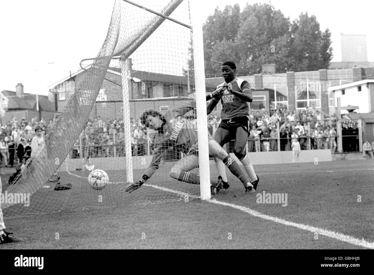 Southampton's George Lawrence (r) forces the ball past Wimbledon ...