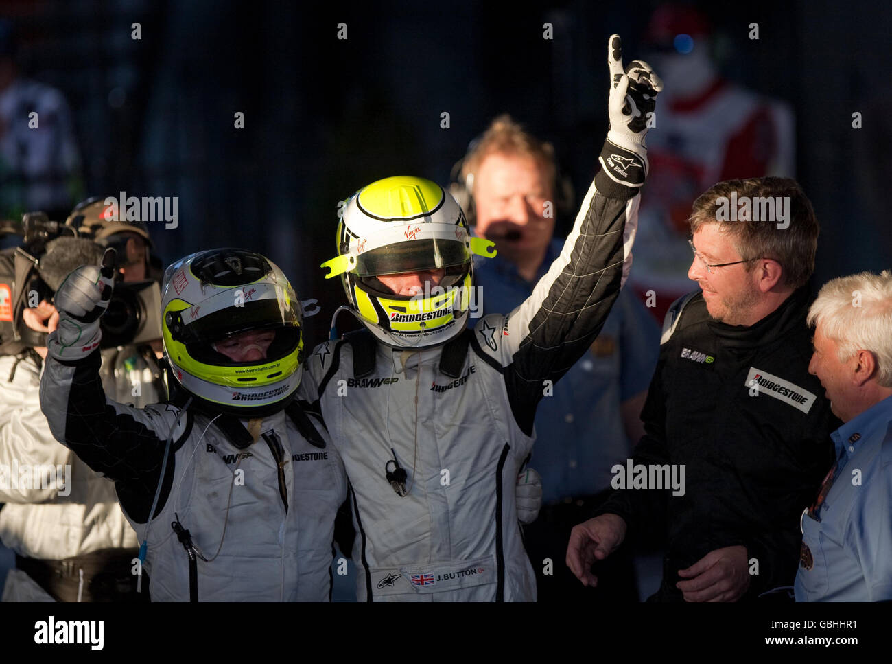 Brawn GP's Jenson Button (centre) celebrates winning the Australian ...