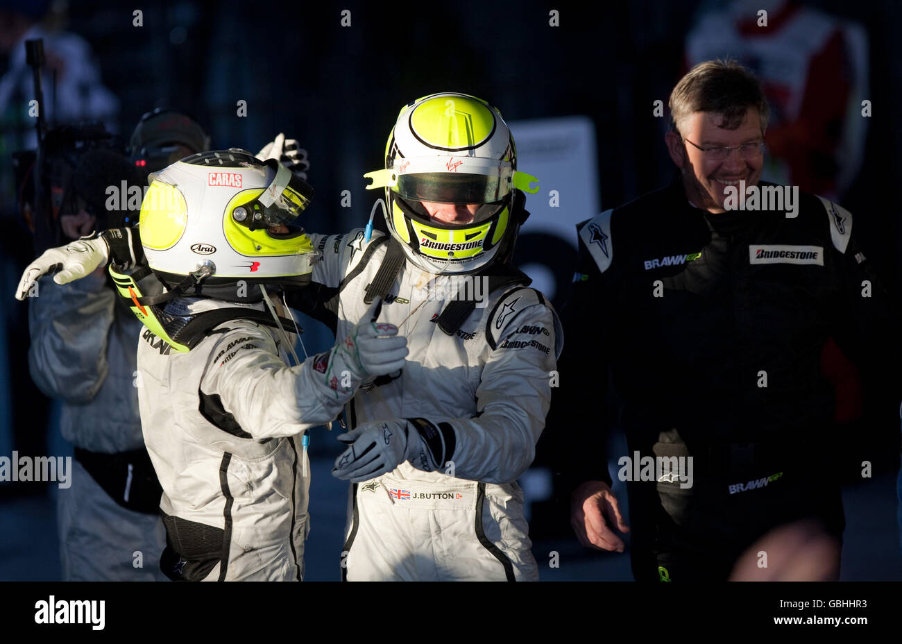 Brawn GP's Jenson Button (centre) celebrates winning the Australian ...