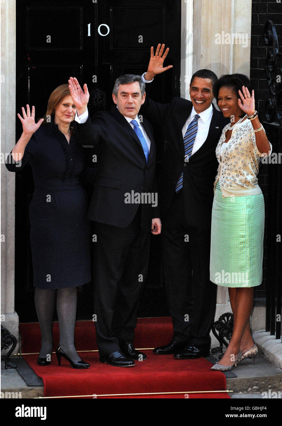 US President Barack Obama (second right) and wife Michelle (right) at ...