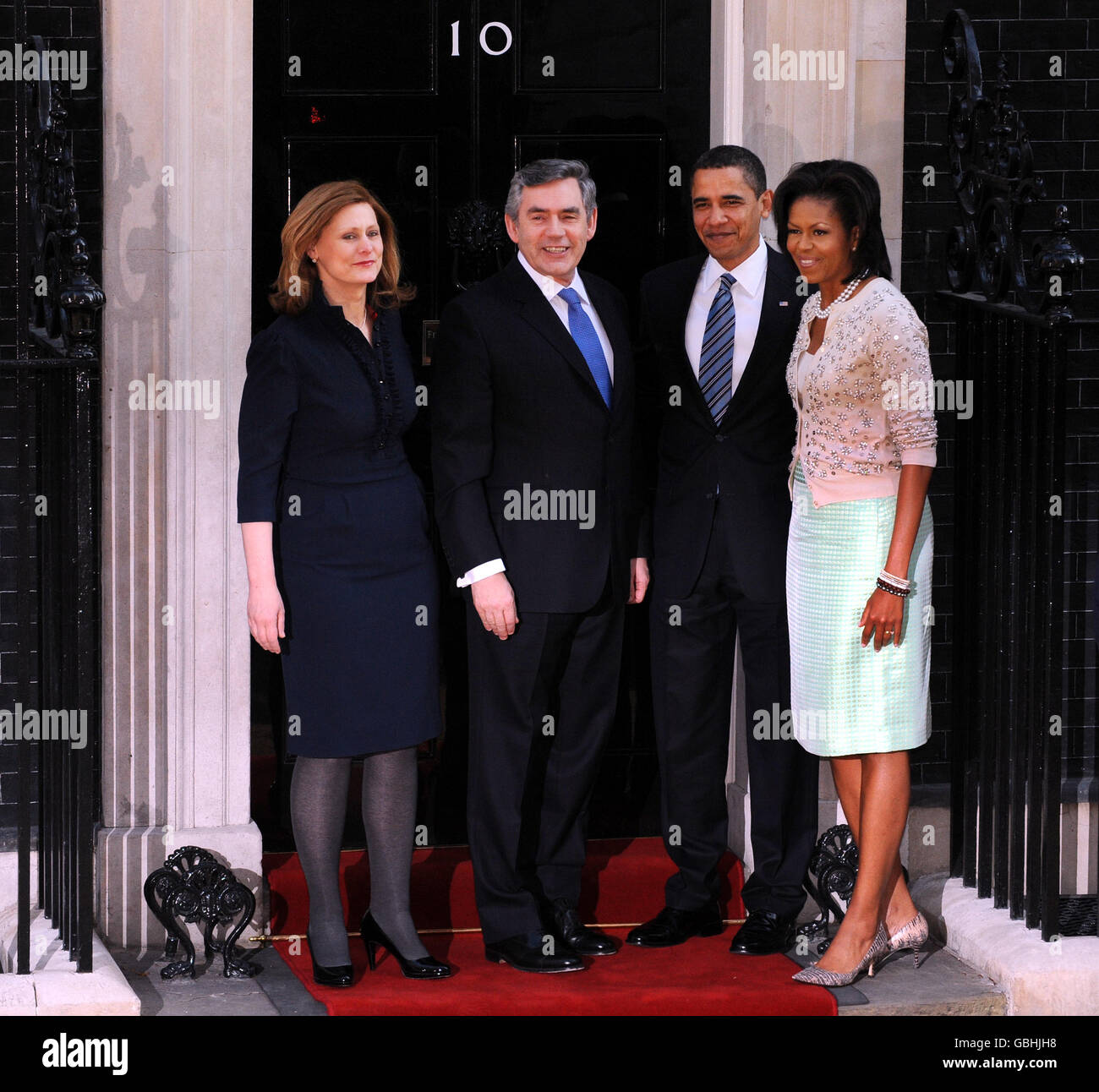 US President Barack Obama (second right) and wife Michelle (right) at ...