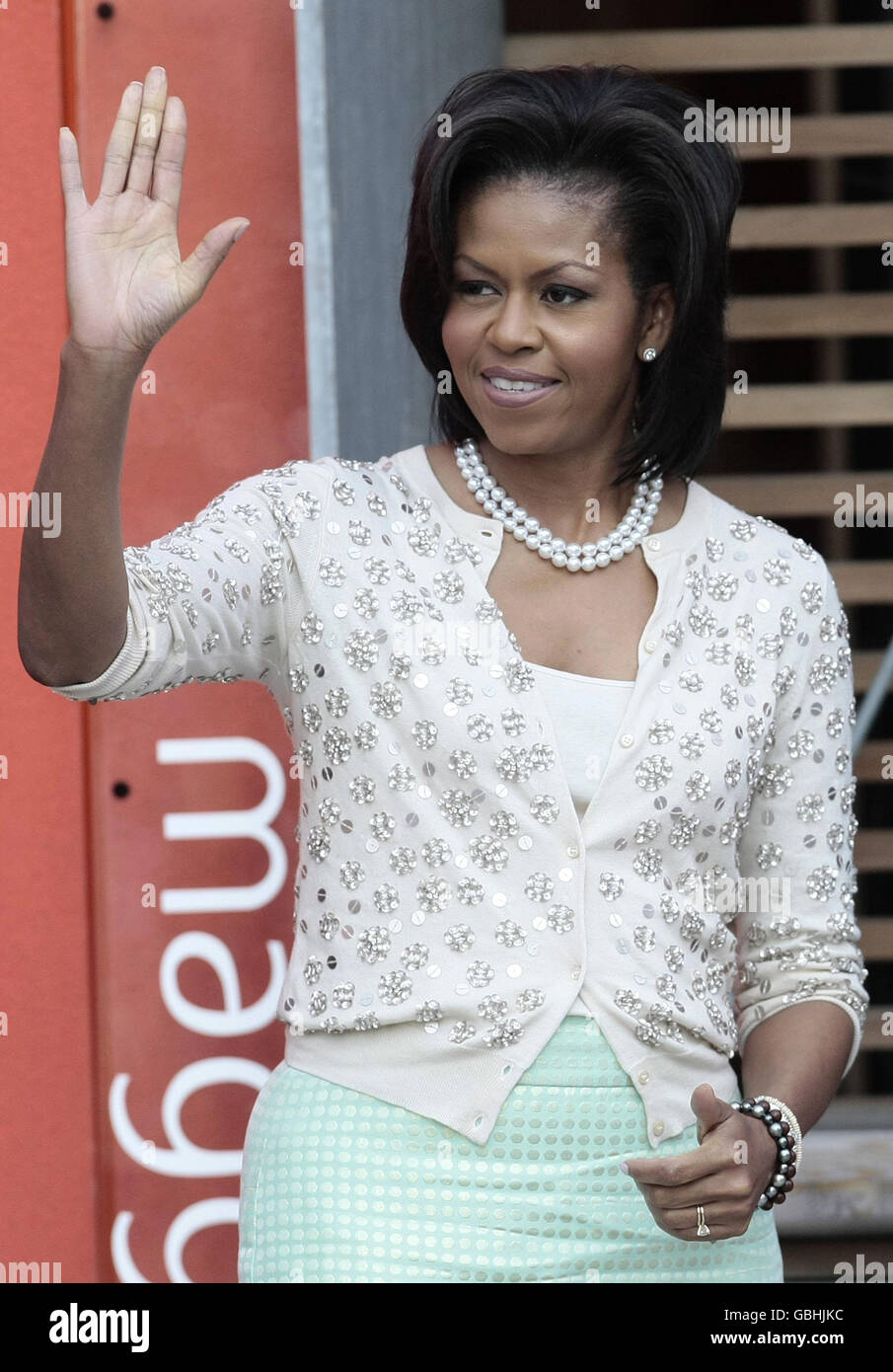 U.S First Lady Michelle Obama waves to the public during her visit to ...