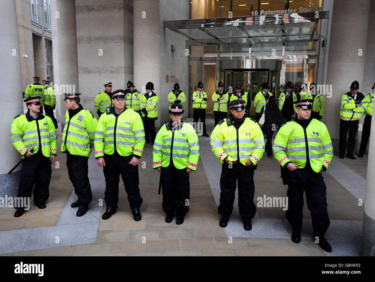 Police at the main entrance to 10 Paternoster Square, which is the site ...