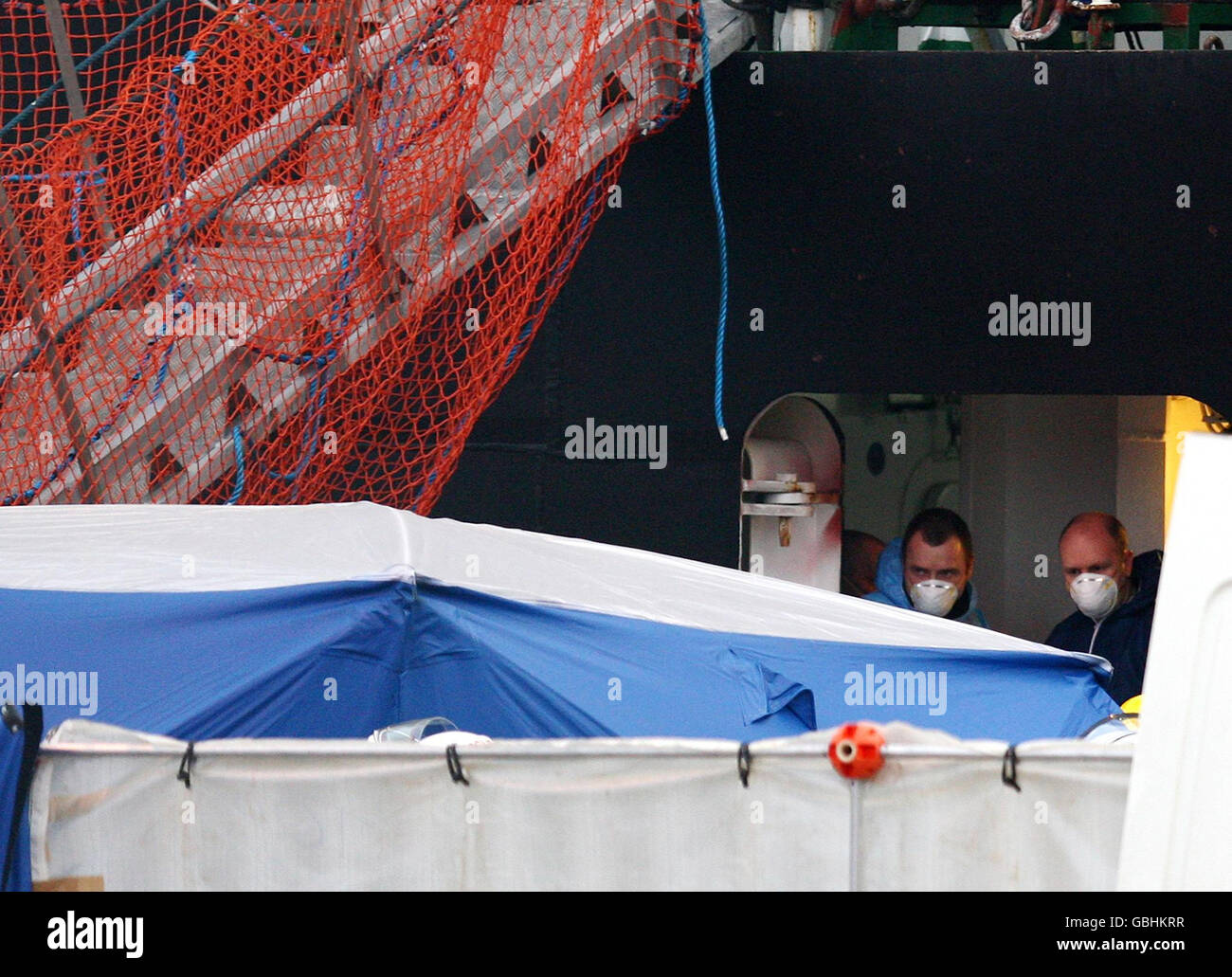 Forensic Officers remove the bodies of the men who were killed when a ...
