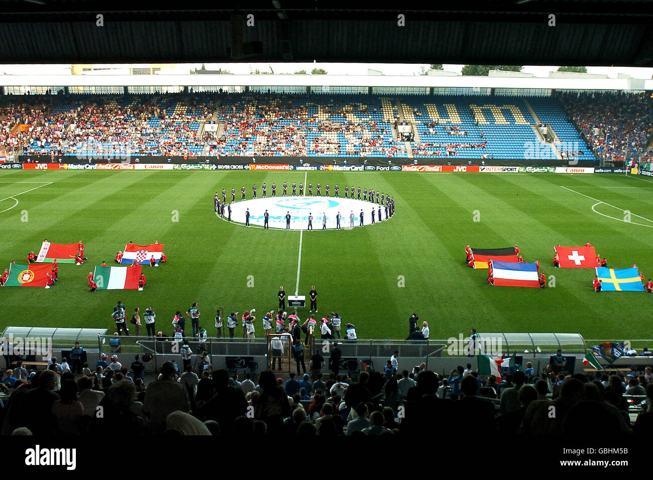 Centre circle ball boys and girls encircle the uefa logo hi-res stock ...