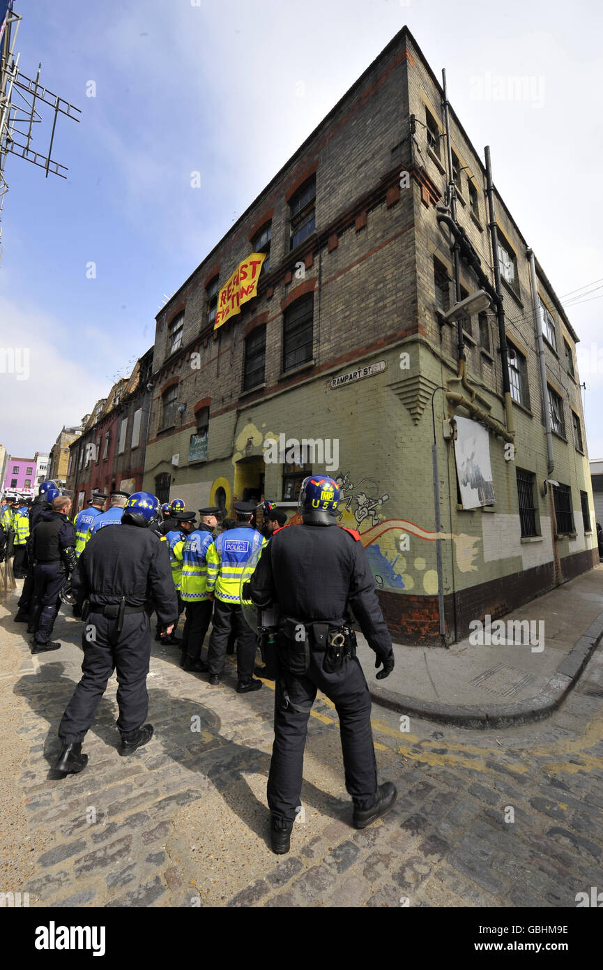 Metropolitan Police officers carry out a raid on a house in Rampart ...