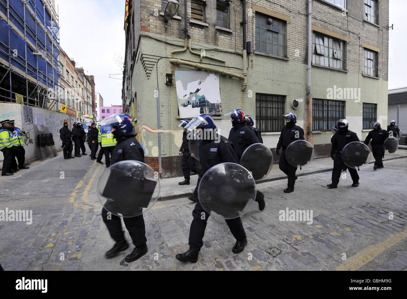 Metropolitan Police officers carry out a raid on a house in Rampart ...