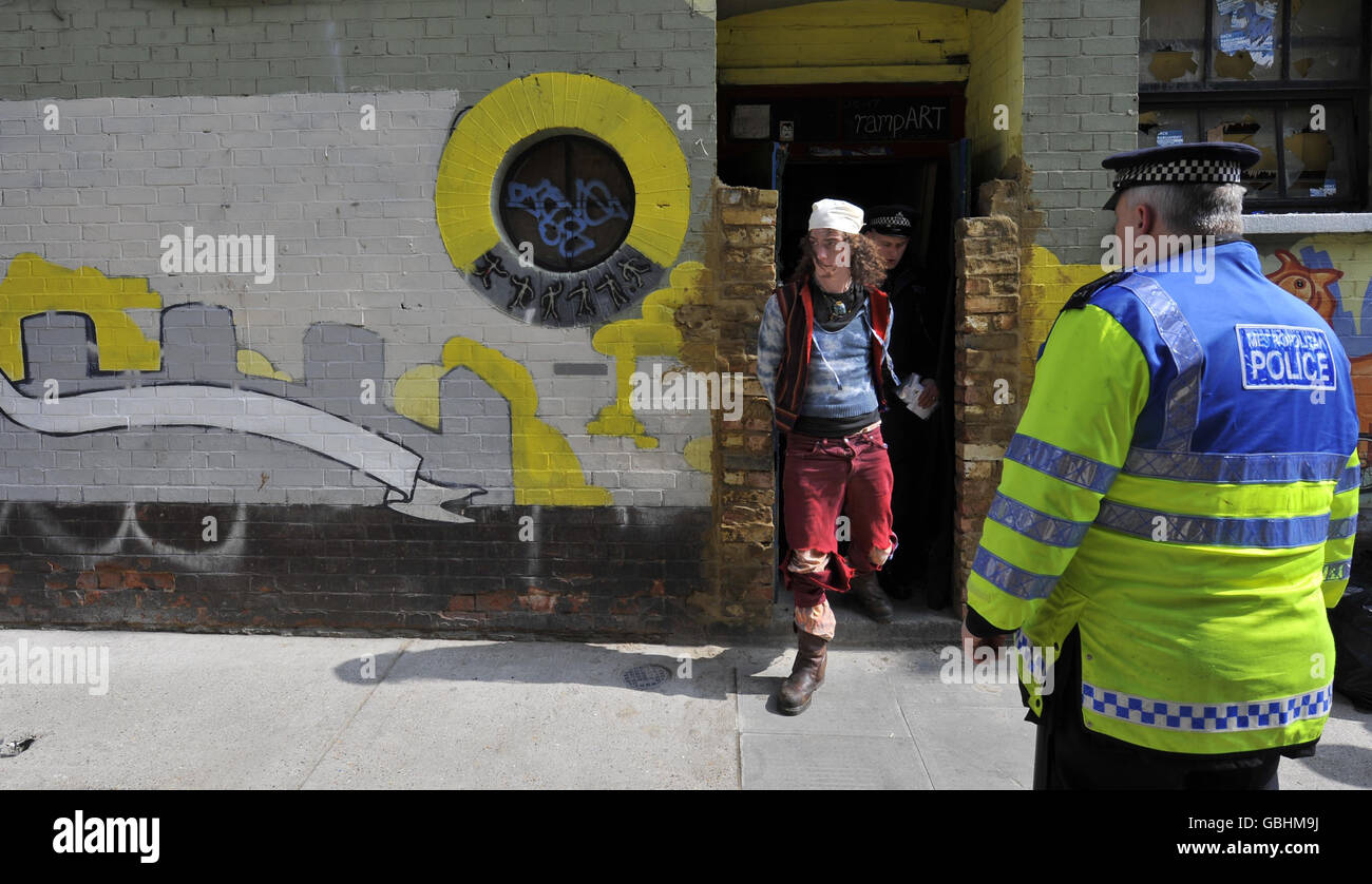 Metropolitan Police officers carry out a raid on a house in Rampart ...