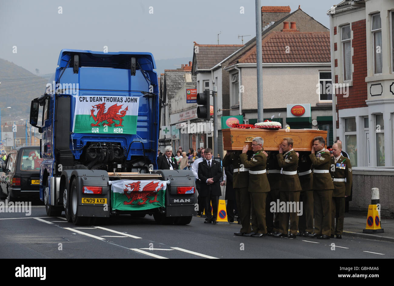 The coffin of Corporal Dean John is carried to the back of a lorry in ...