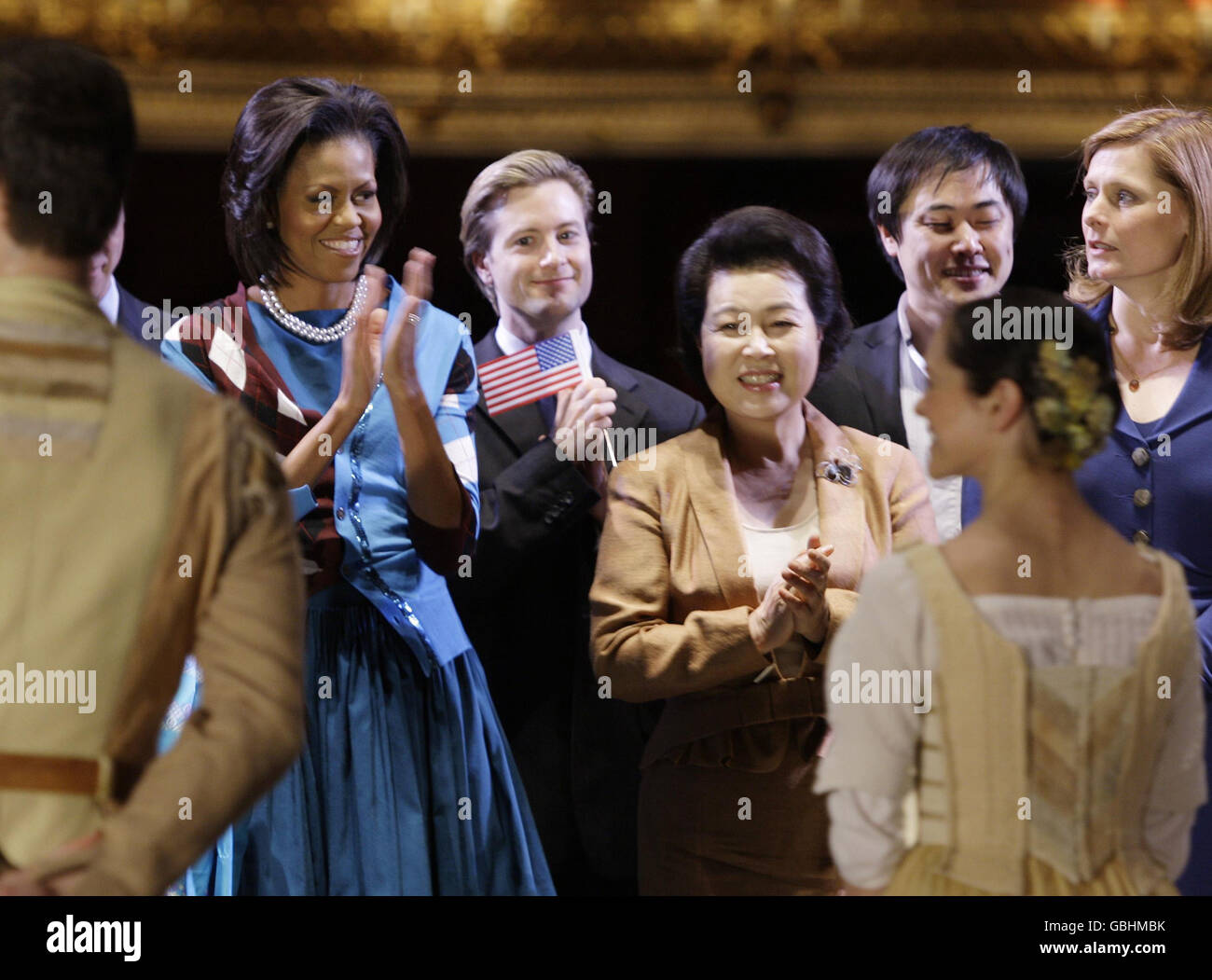 US first lady Michelle Obama applauds dancers after they performed ...