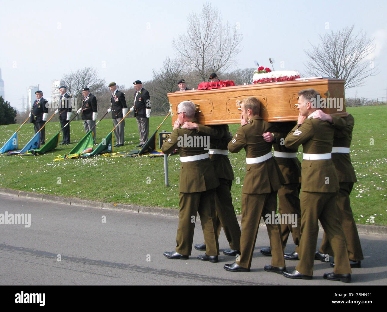 The coffin of Corporal Dean John, 25, is carried at his funeral service ...