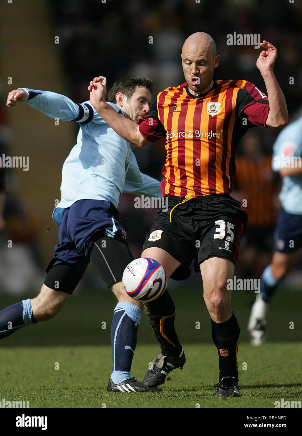 Bradford City's Paul Mullin and Brentford's Alan Bennett in action ...