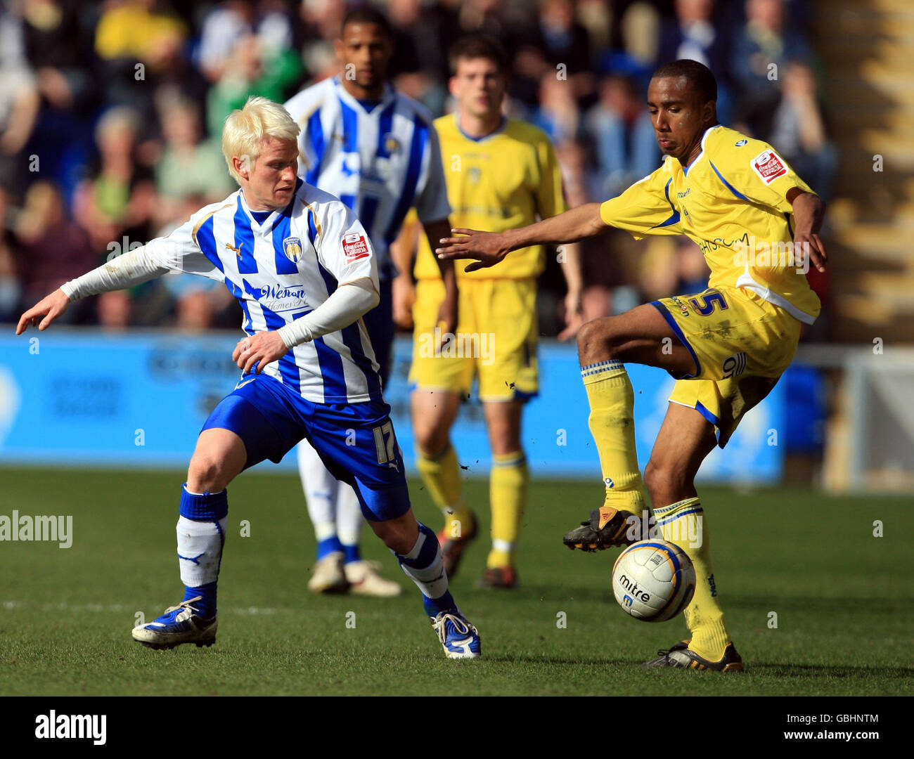 Colchester United's David Perkins (left )and Leeds United's Fabian ...
