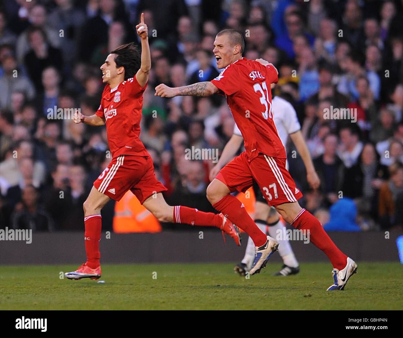 Liverpool's Yossi Benayoun (left) runs to celebrate scoring the winning ...
