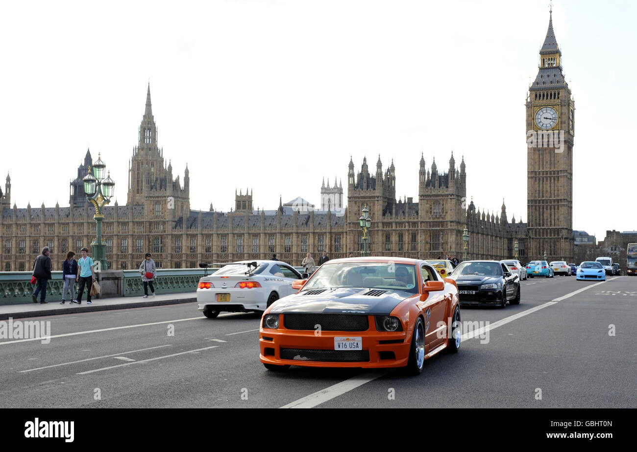 A convoy of Fast and Furious muscle cars drive across Westminster ...