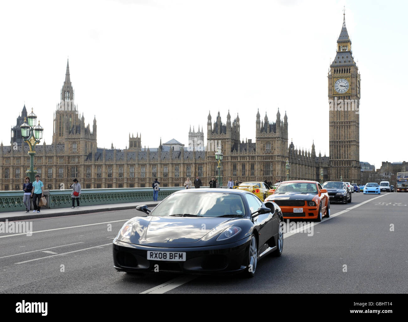 A convoy of Fast and Furious muscle cars drive across Westminster ...