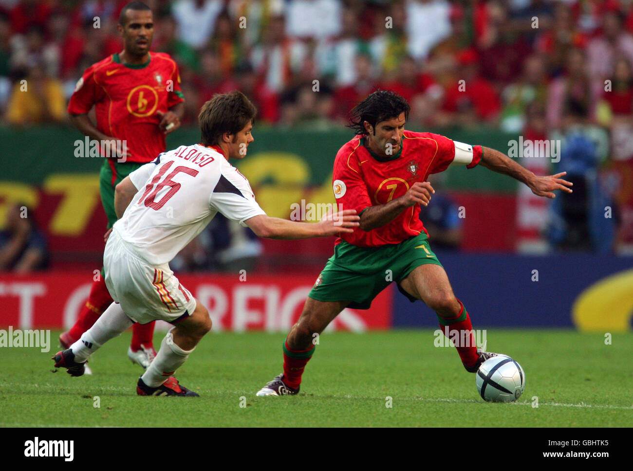 Spains xabi alonso portugals luis figo battle for the ball hi-res stock ...