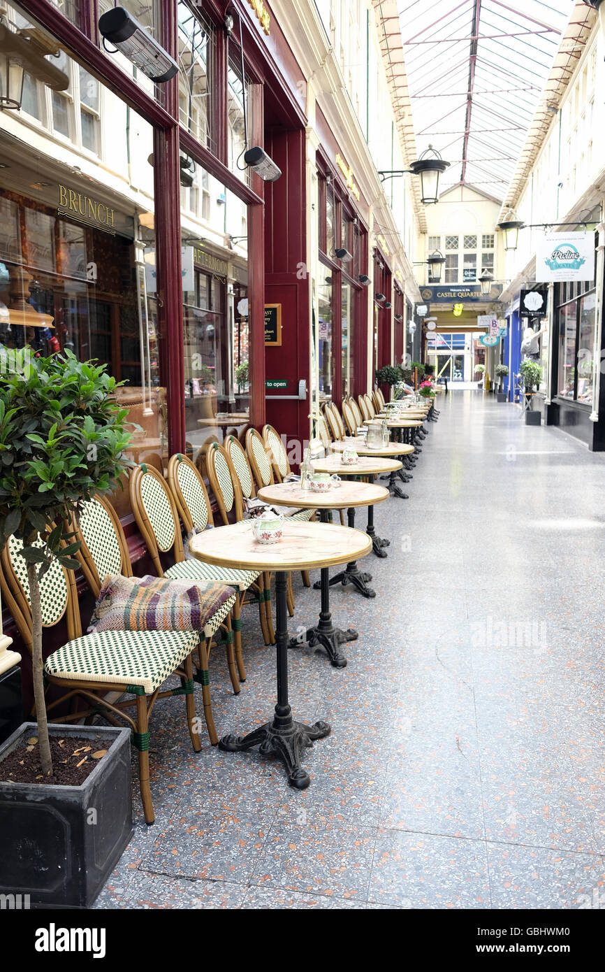 Line of café chairs in Cardiff Castle Quarter arcade July 2016 Stock ...