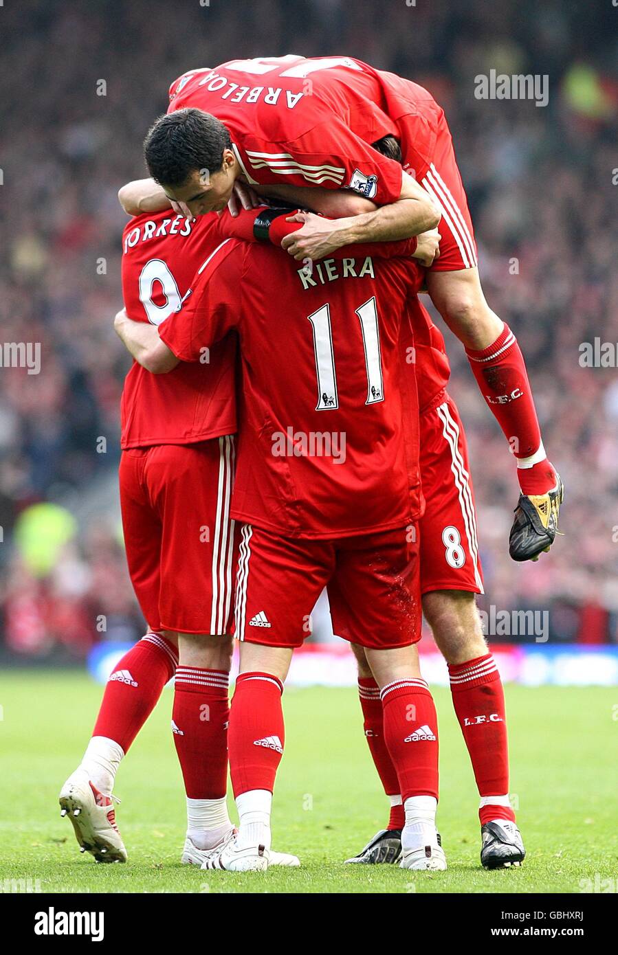 Liverpool's Albert Riera (right) celebrates scoring his sides second ...