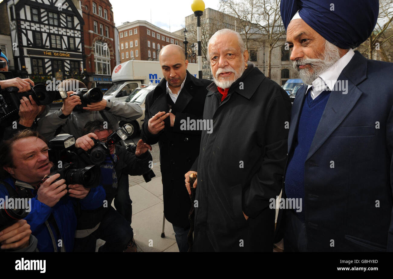 Davender Ghai (second right) arrives at the High Court in London, where ...