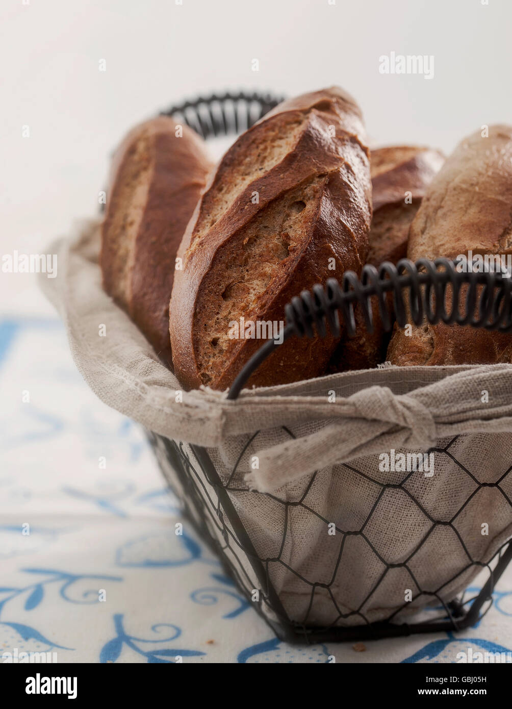 Mini baguette in a rustic basket Stock Photo - Alamy