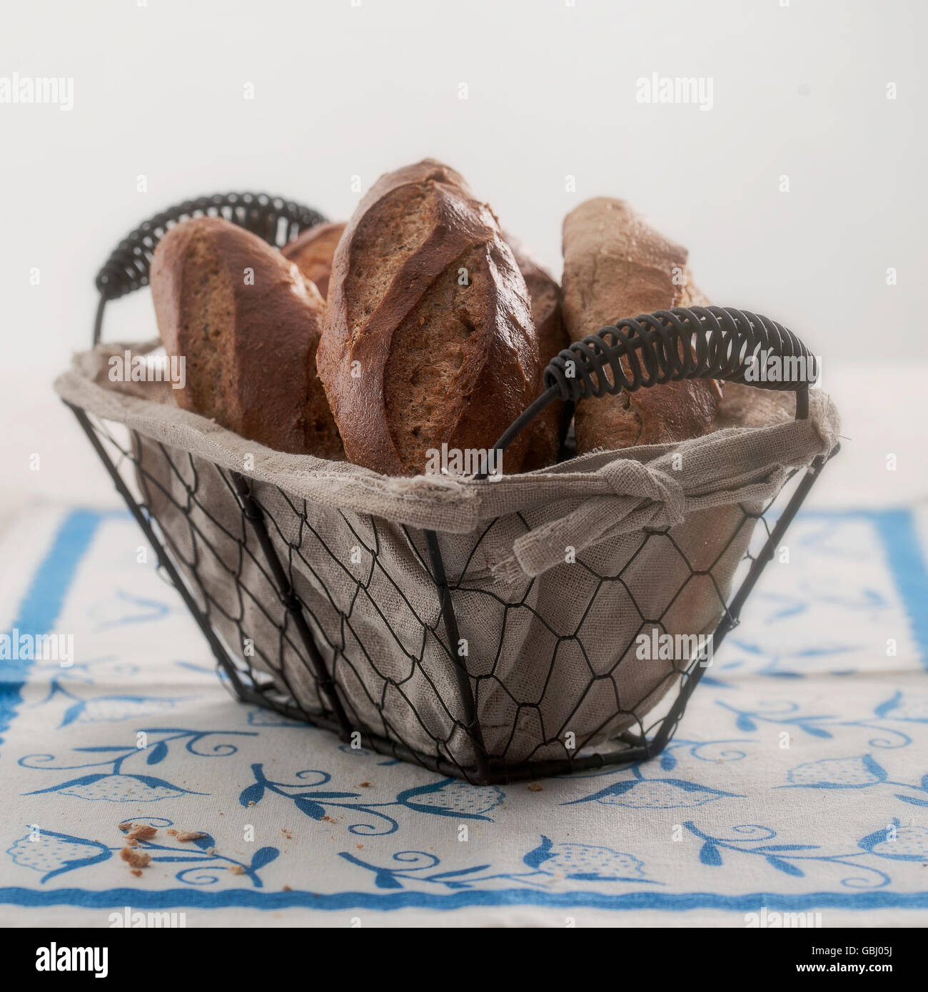 Mini baguette in a rustic basket Stock Photo - Alamy