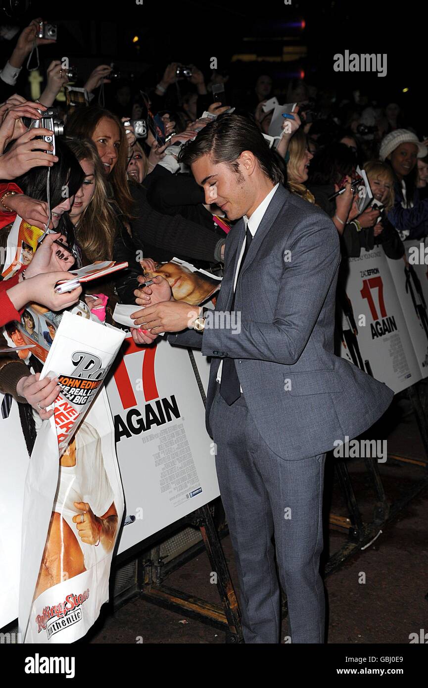 Zac Efron signs autographs for fans as he arrives for the UK Premiere ...