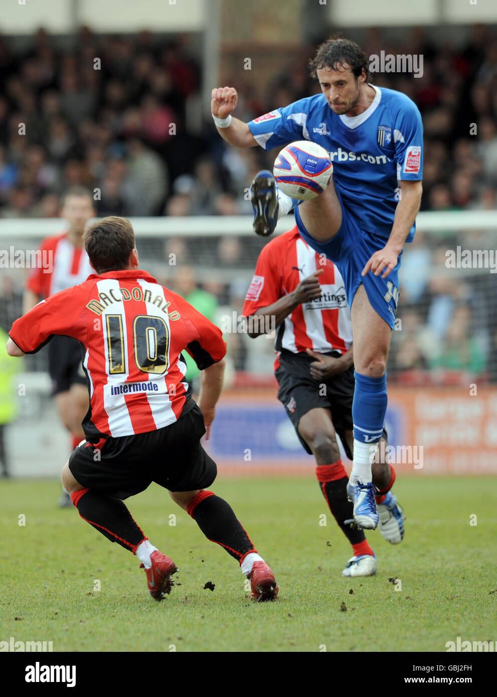 Gillingham's Adam Miller (right) controls the ball during the Coca-Cola ...