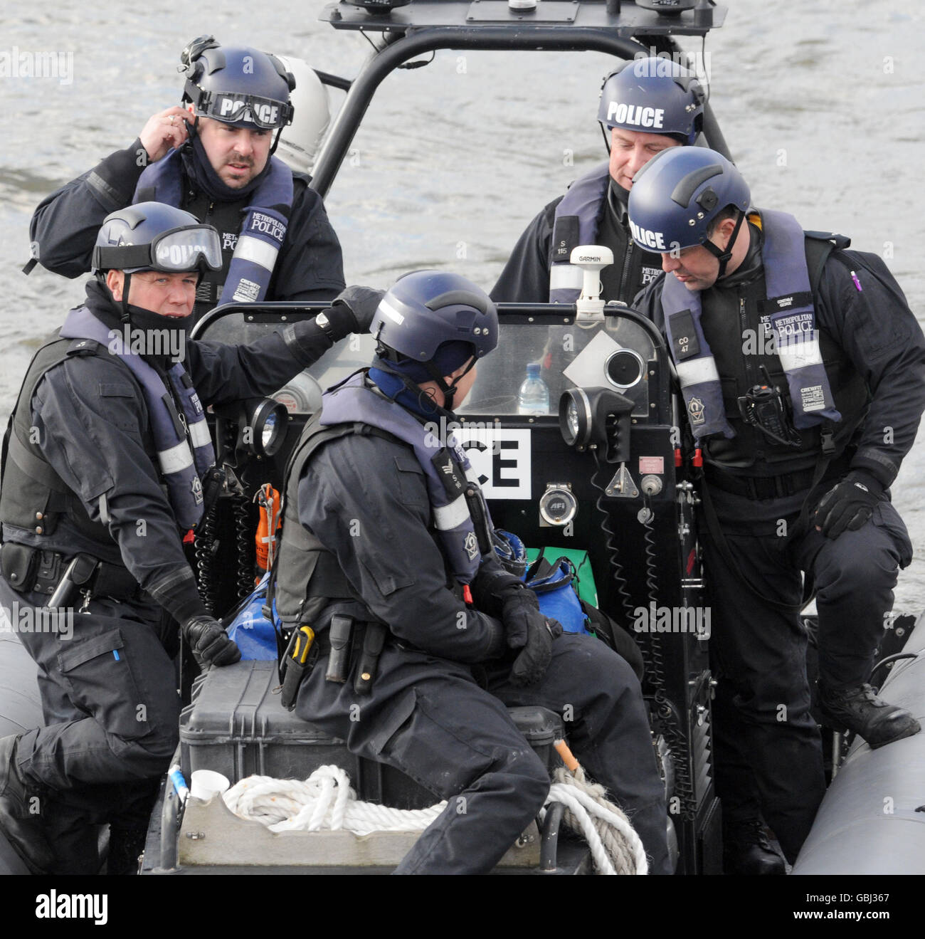 Police patrol the river Thames during the 155th University Boat Race ...