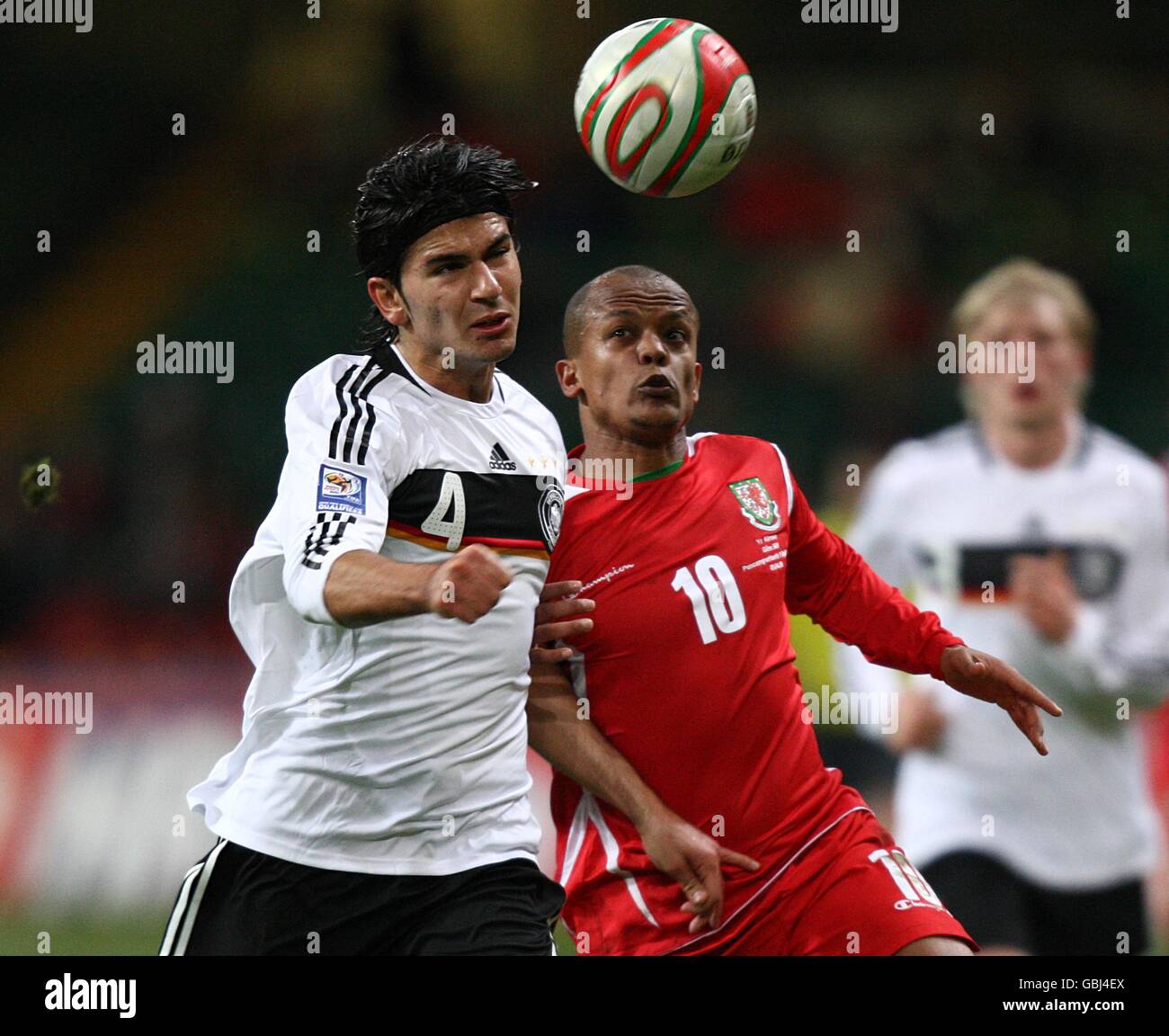 Germany's Serdar Tasci (left) and Wales' Robert Earnshaw (right) battle ...