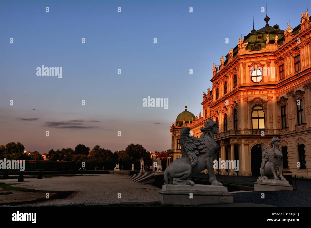 Upper Belvedere Palace with female Sphinx statues at sunset Stock Photo ...