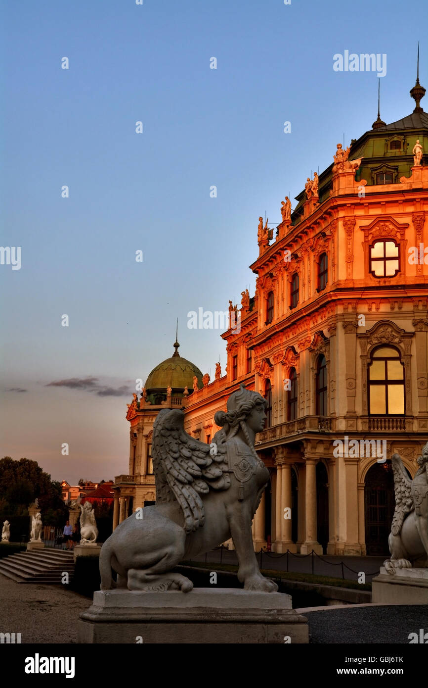Upper Belvedere Palace with female Sphinx statues at sunset Stock Photo ...
