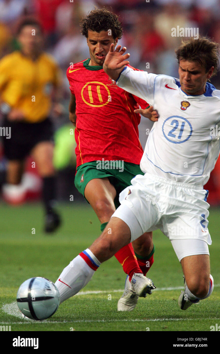 Russia's Alexey Bugaev and Portugal's Sabrosa Simao battle for the ball ...