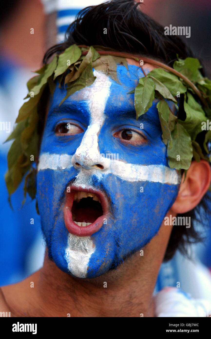 A greece fan wears their colours with pride hi-res stock photography ...