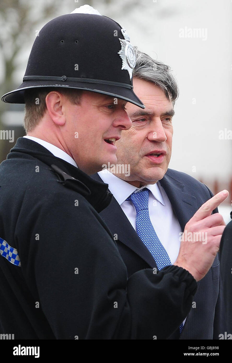Prime Minister Gordon Brown talks to a police officer at the Harraby ...