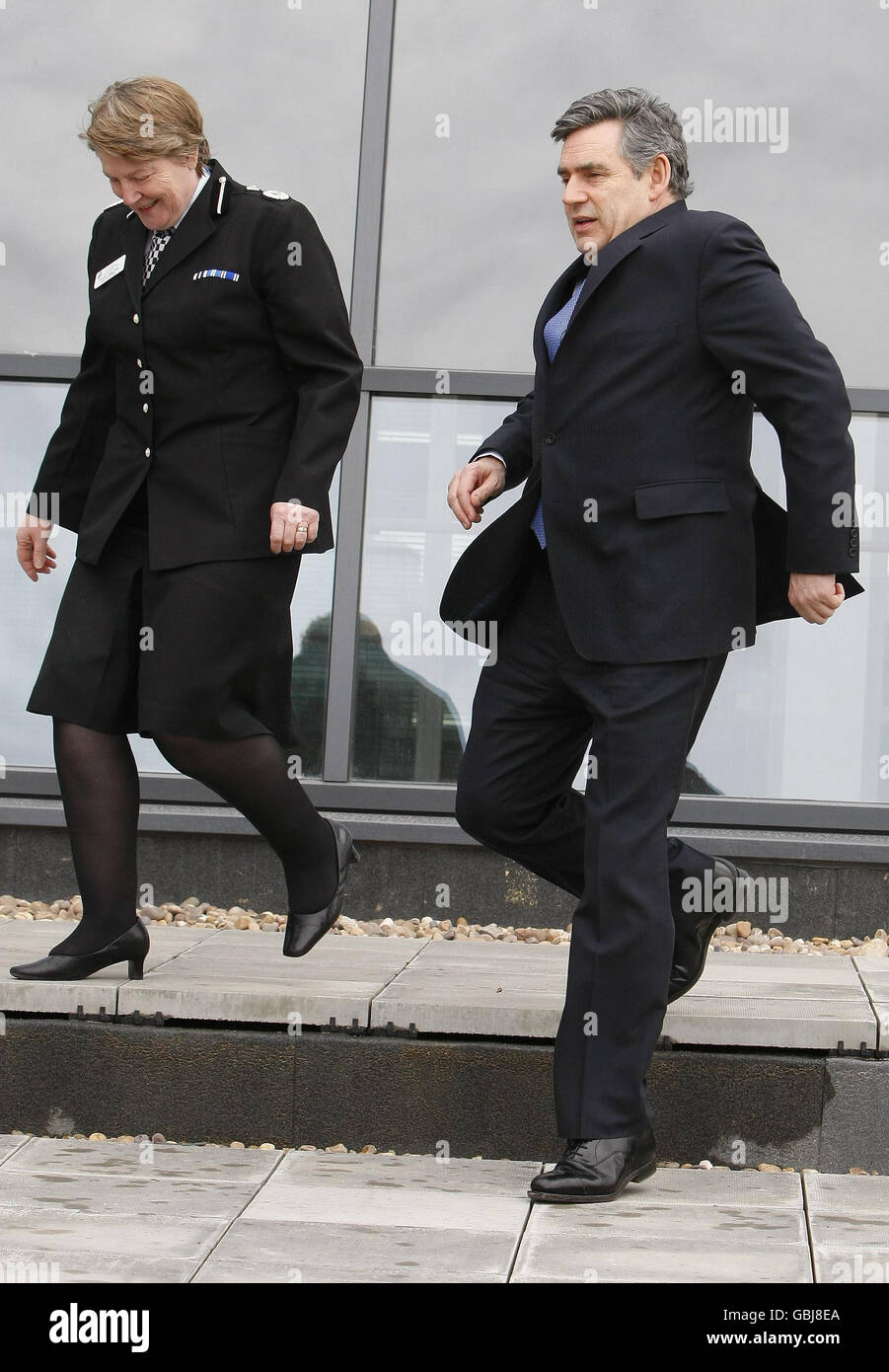 Prime Minister Gordon Brown walks with Deputy Chief Constable Christine ...