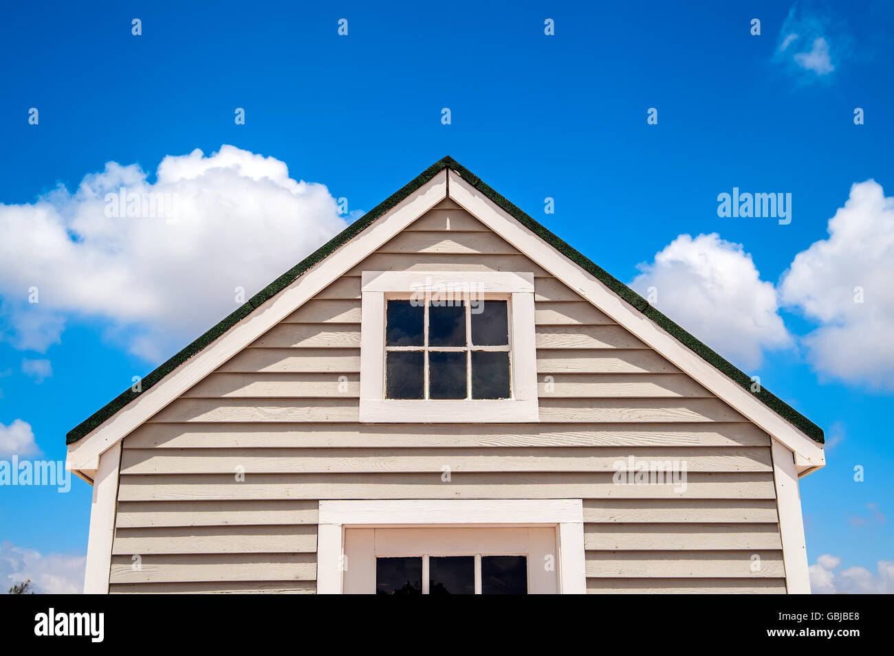 Fragment of the small wooden house, sky background Stock Photo - Alamy