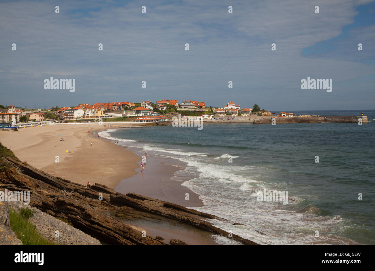 View of the beach and harbour at the seaside resort of comillas ...