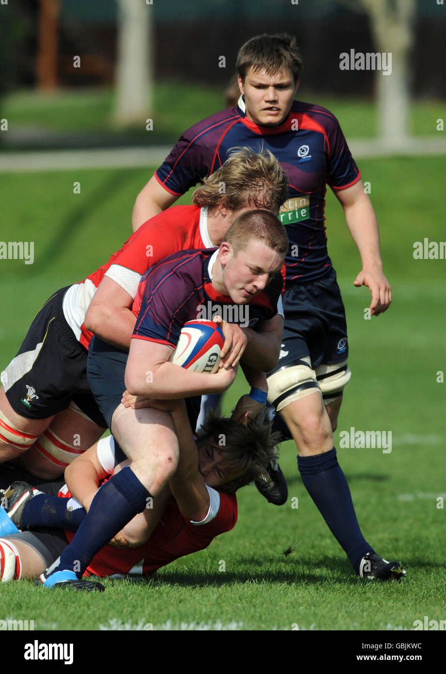 Scotland's Fraser Watt (centre) makes ground with ball in hand during ...