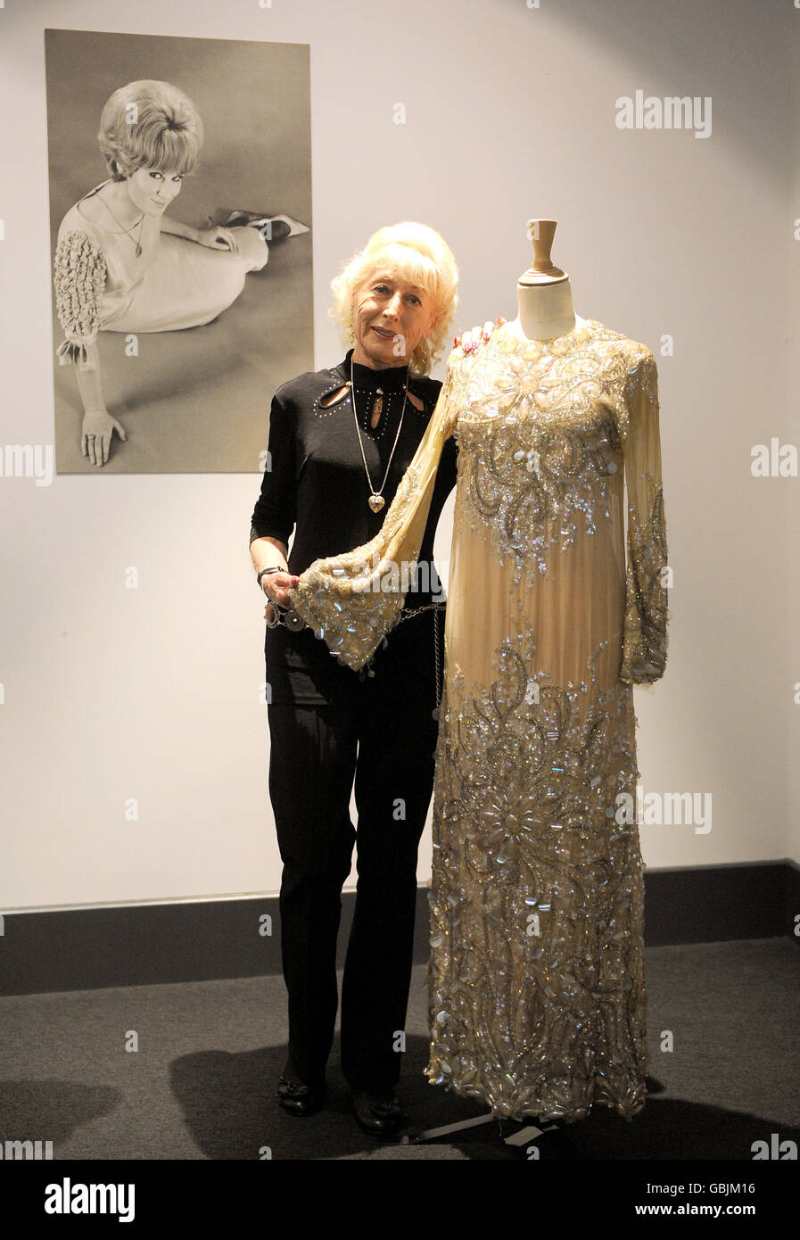 Dusty Springfield's secretary Pat Rhodes, poses with the dress worn on ...