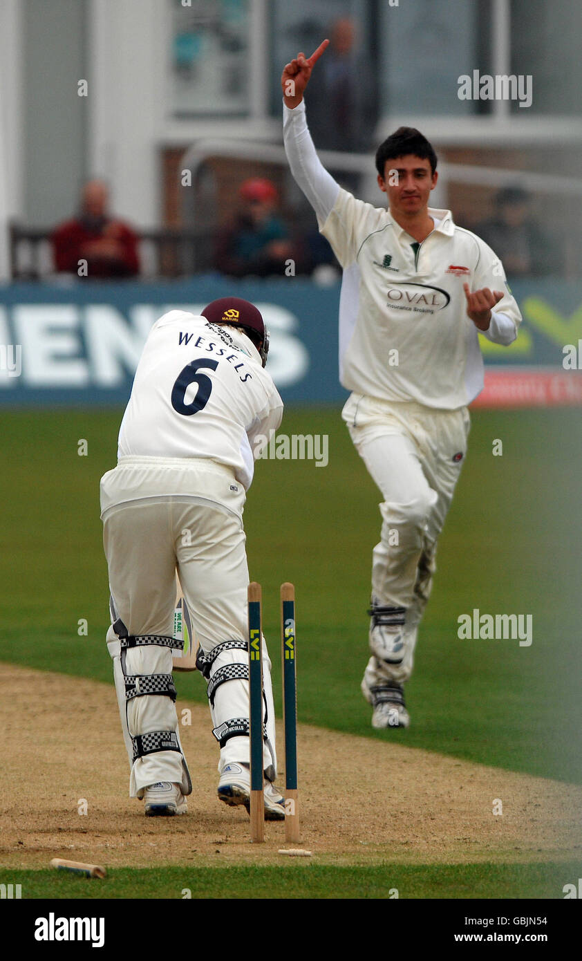 Leicestershire's Sam Cliff (right) celebrates after he bowls ...