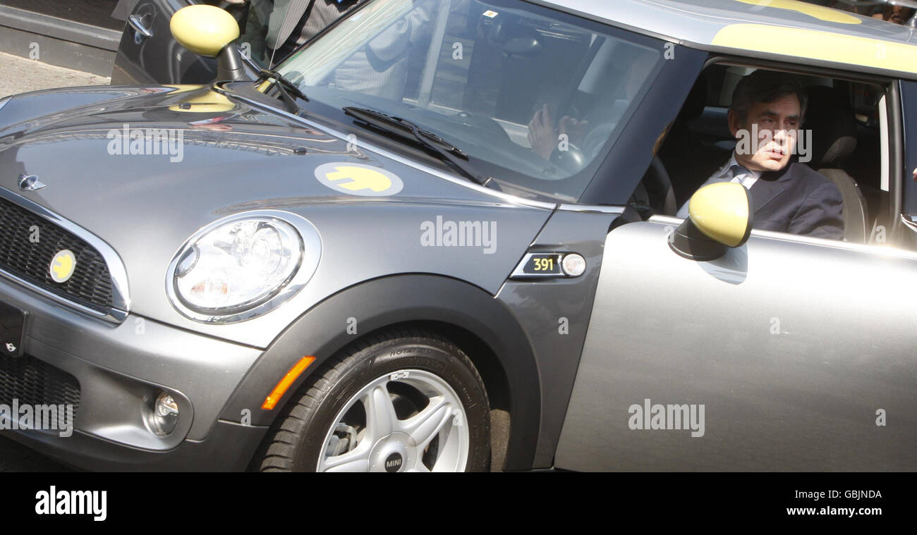 Prime Minister Gordon Brown sits in a Mini E electric vehicle at the ...