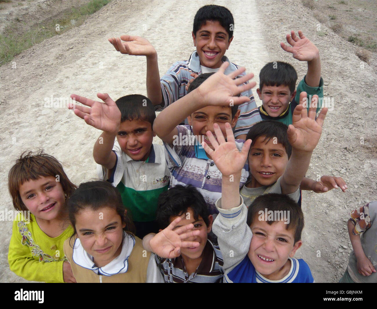 Iraqi villagers sad to see British soldiers leave Stock Photo - Alamy