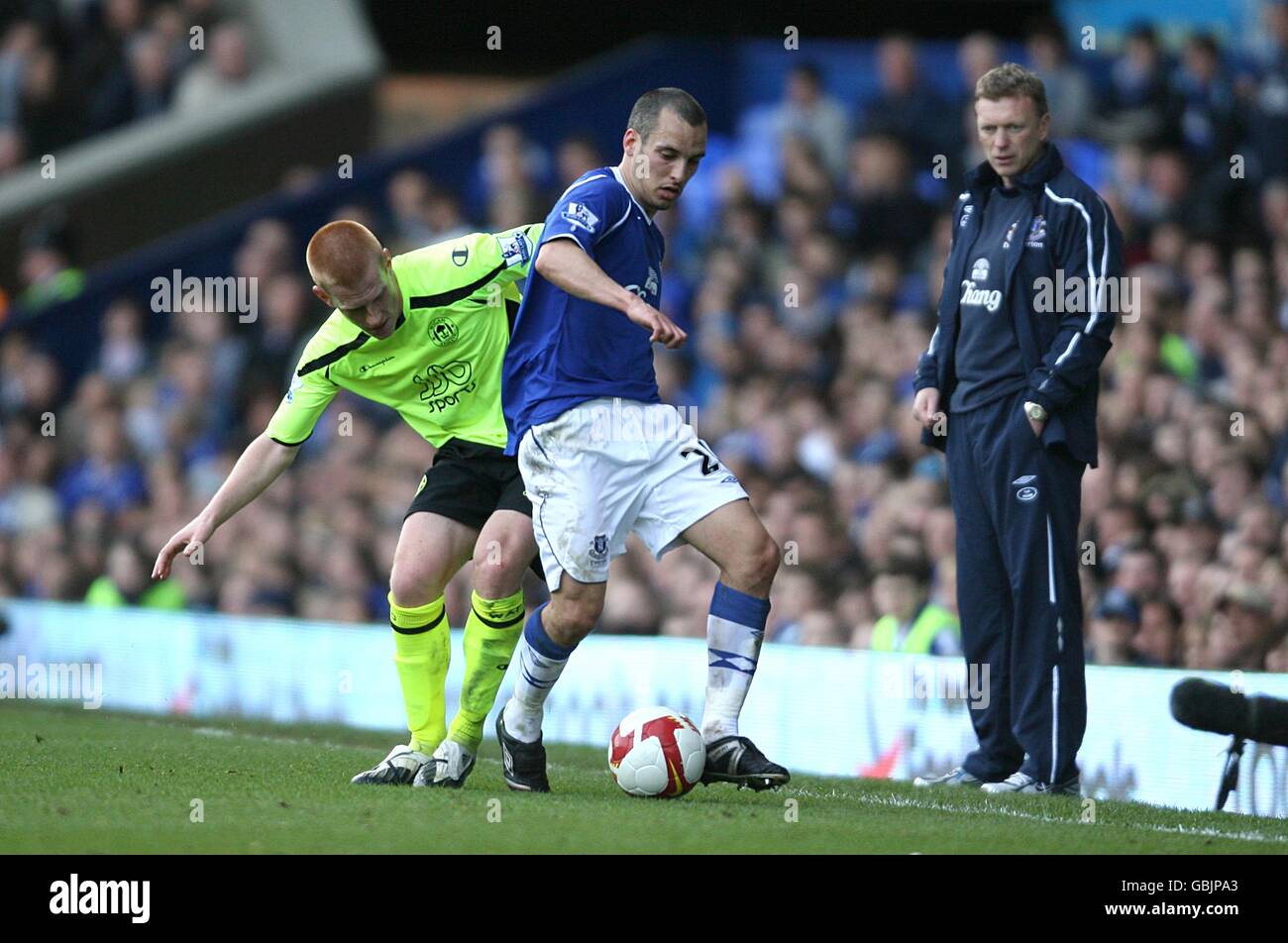 Everton's Leon Osman (centre) and Wigan Athletic's Ben Watson (left ...