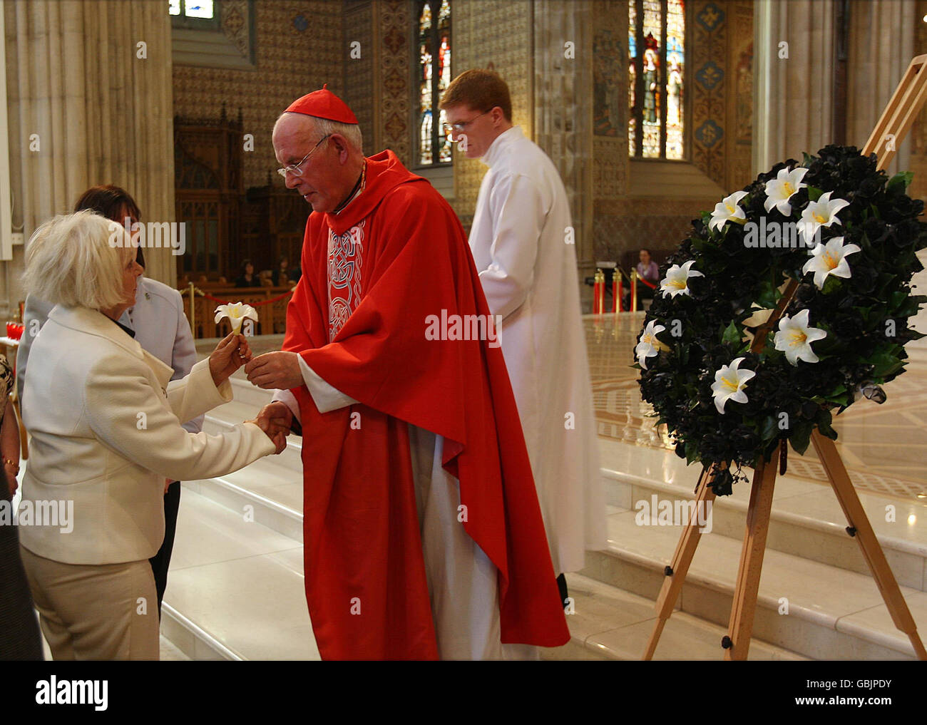 Cardinal Sean Brady performs a Palm Sunday mass for the relatives of ...