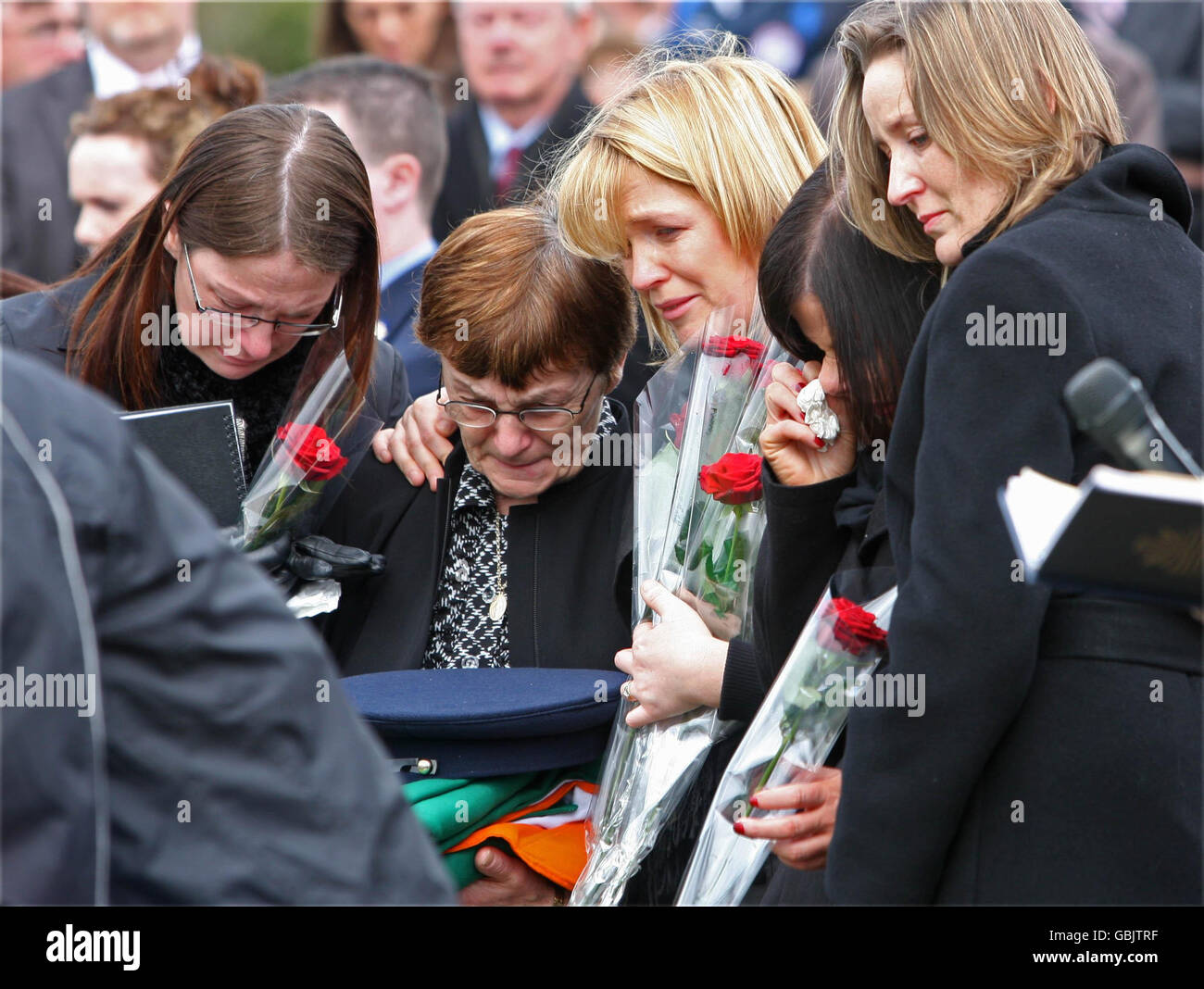 The family of Robert McCallion at his funeral today. The garda was ...