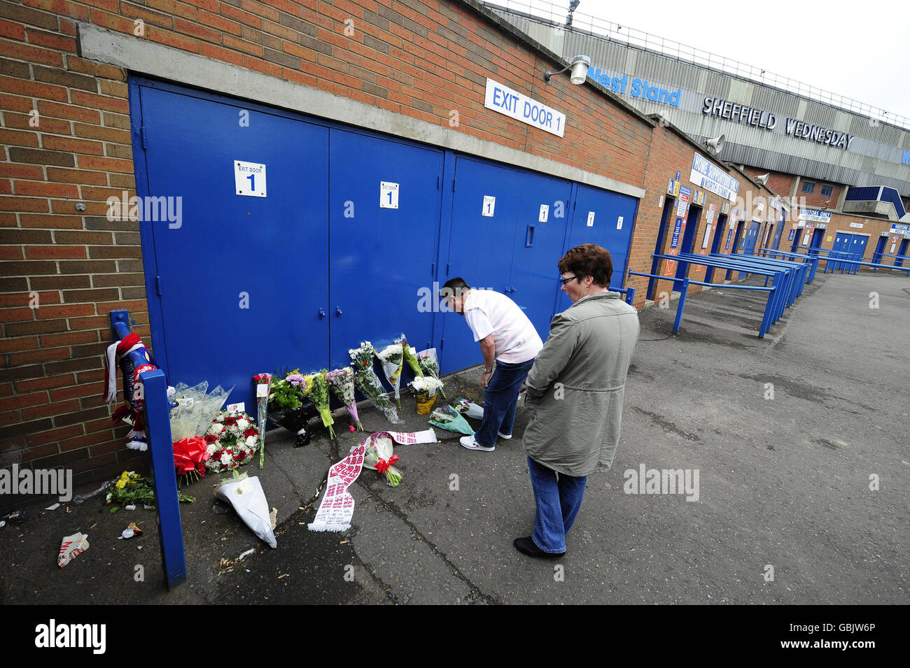 Fans pay tribute at the Leppings Lane entrance to Sheffield Wednesday ...