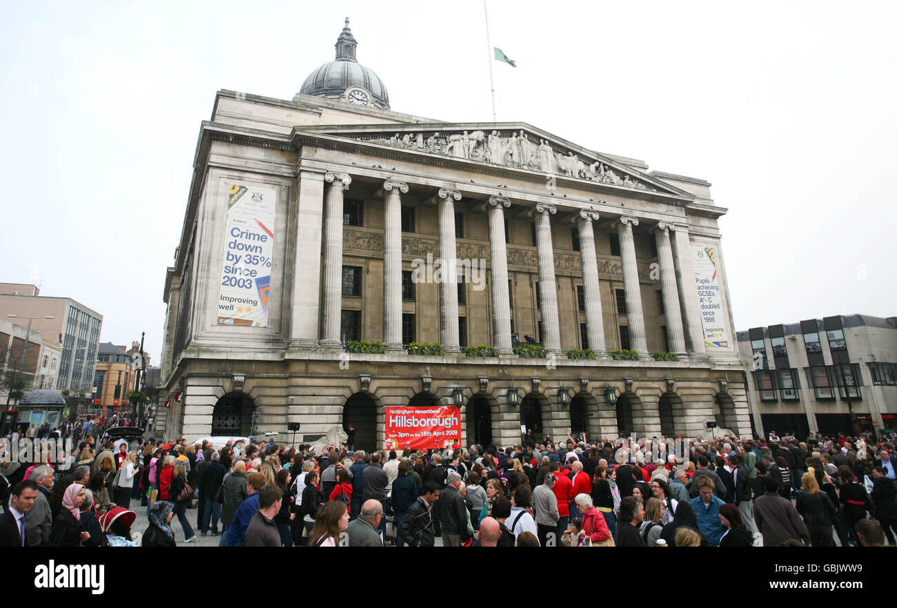 A crowd gathers outside the Council House in the City's Market Square ...