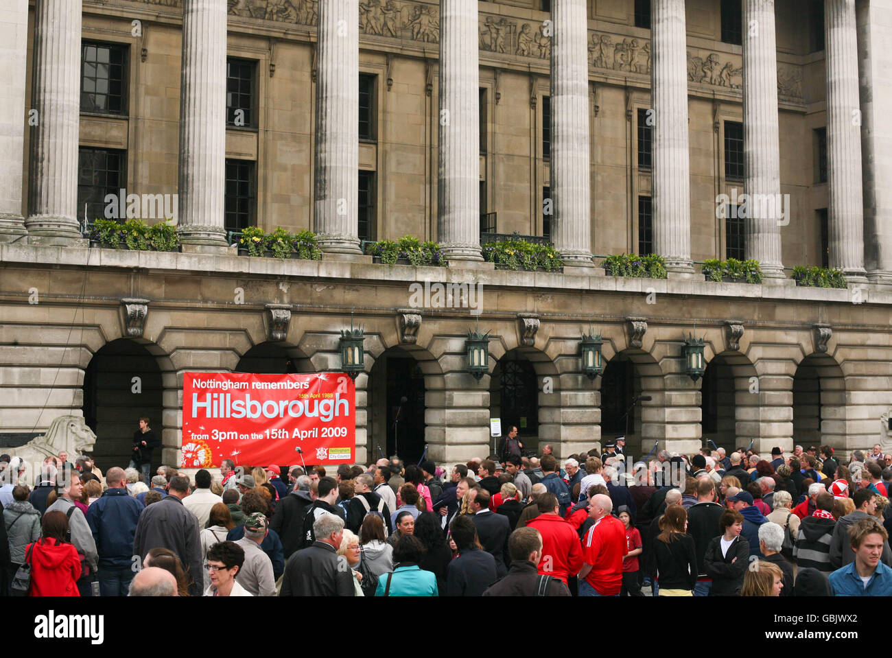 A crowd gathers outside the Council House in the City's Market Square ...