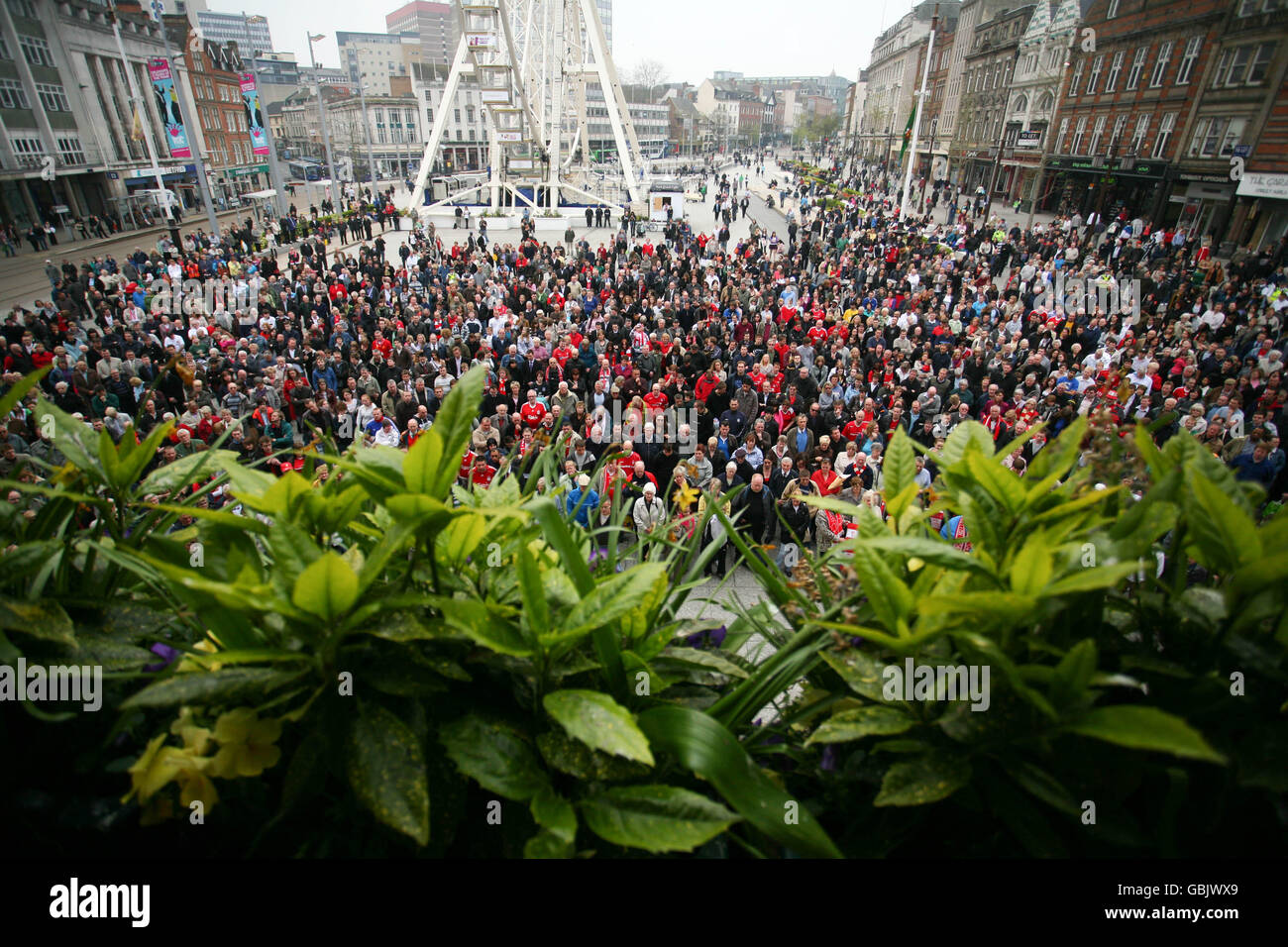 A crowd gathers outside the Council House in the City's Market Square ...
